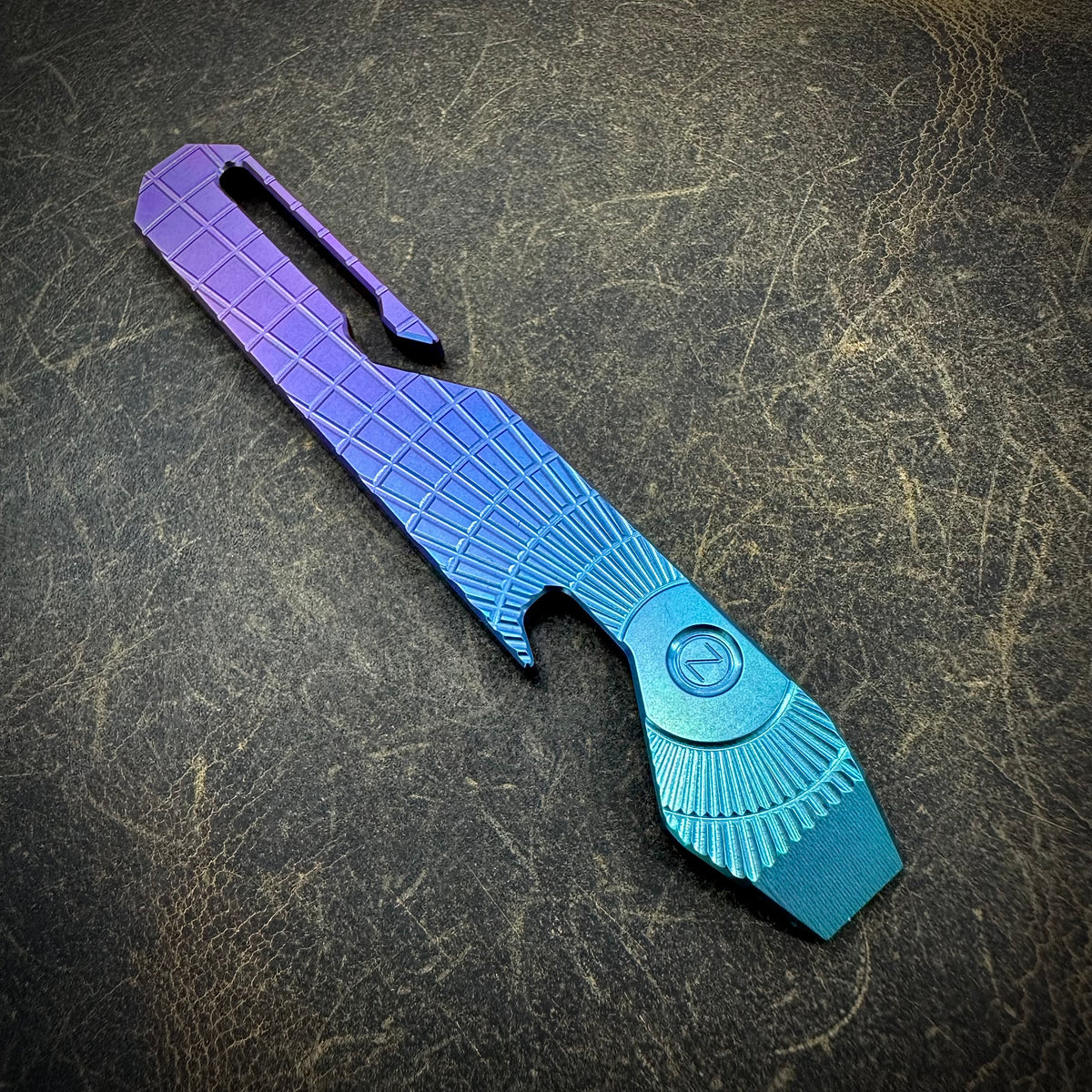 Teal to Blurple Fade Anodized OZ Pry. Radial Frag Milling on one side ...